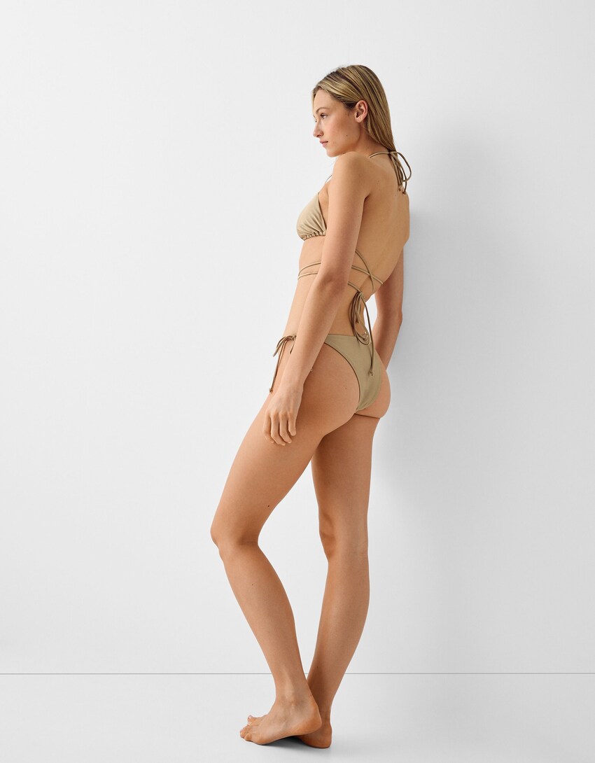 Shimmery bikini top with ring details - Women | Bershka