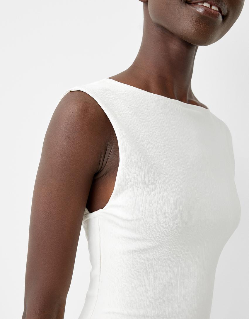 Textured mini dress with open back - BSK Teen | Bershka