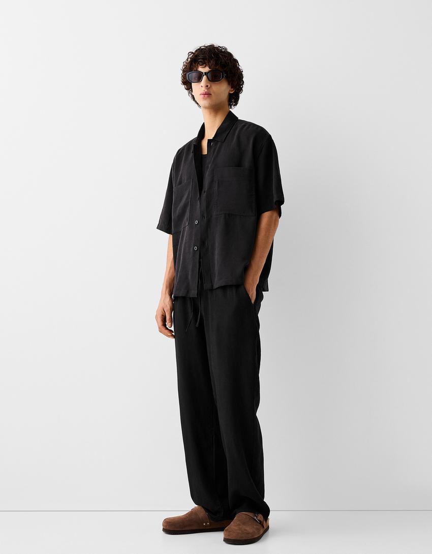 بنطال رياضي كتان واسع الساقين الرجل Bershka