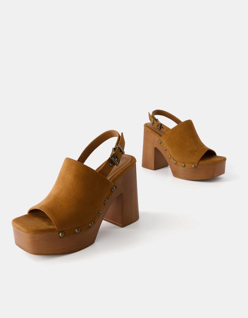 High-heel studded platform clogs - Women | Bershka