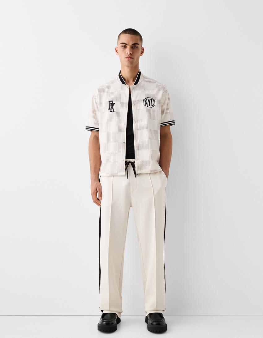 Interlock trousers with side stripes - Men | Bershka