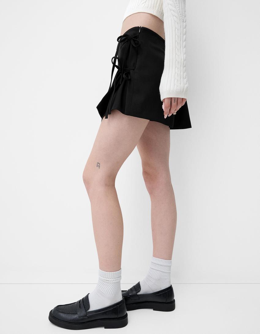 Minirok met bandplooi en strik - Dames | Bershka