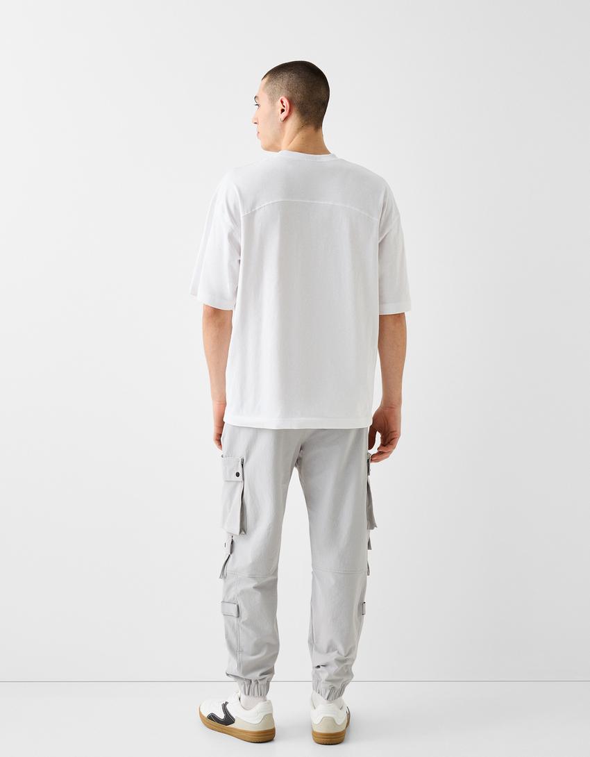 Multi-cargo technical trousers - Men | Bershka