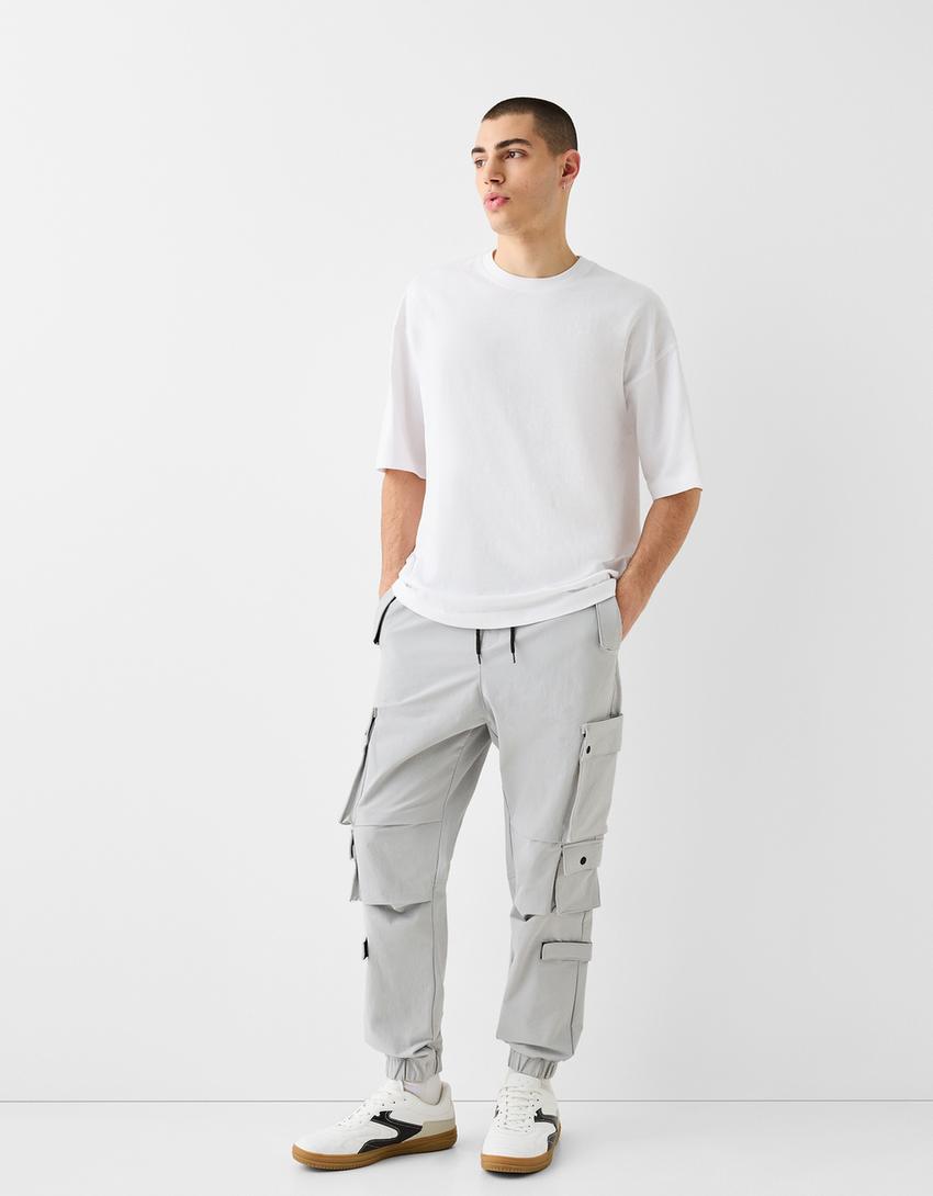 Multi-cargo technical trousers - Men | Bershka