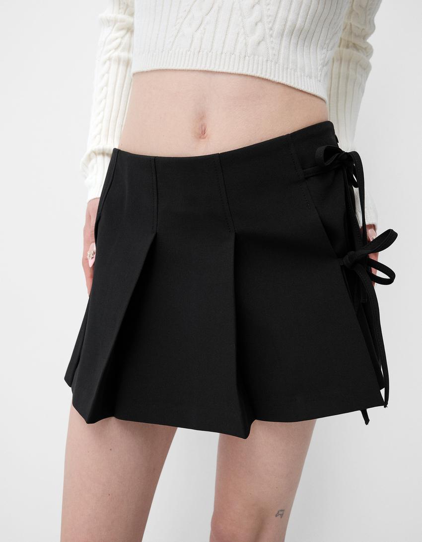 Minirok met bandplooi en strik - Dames | Bershka